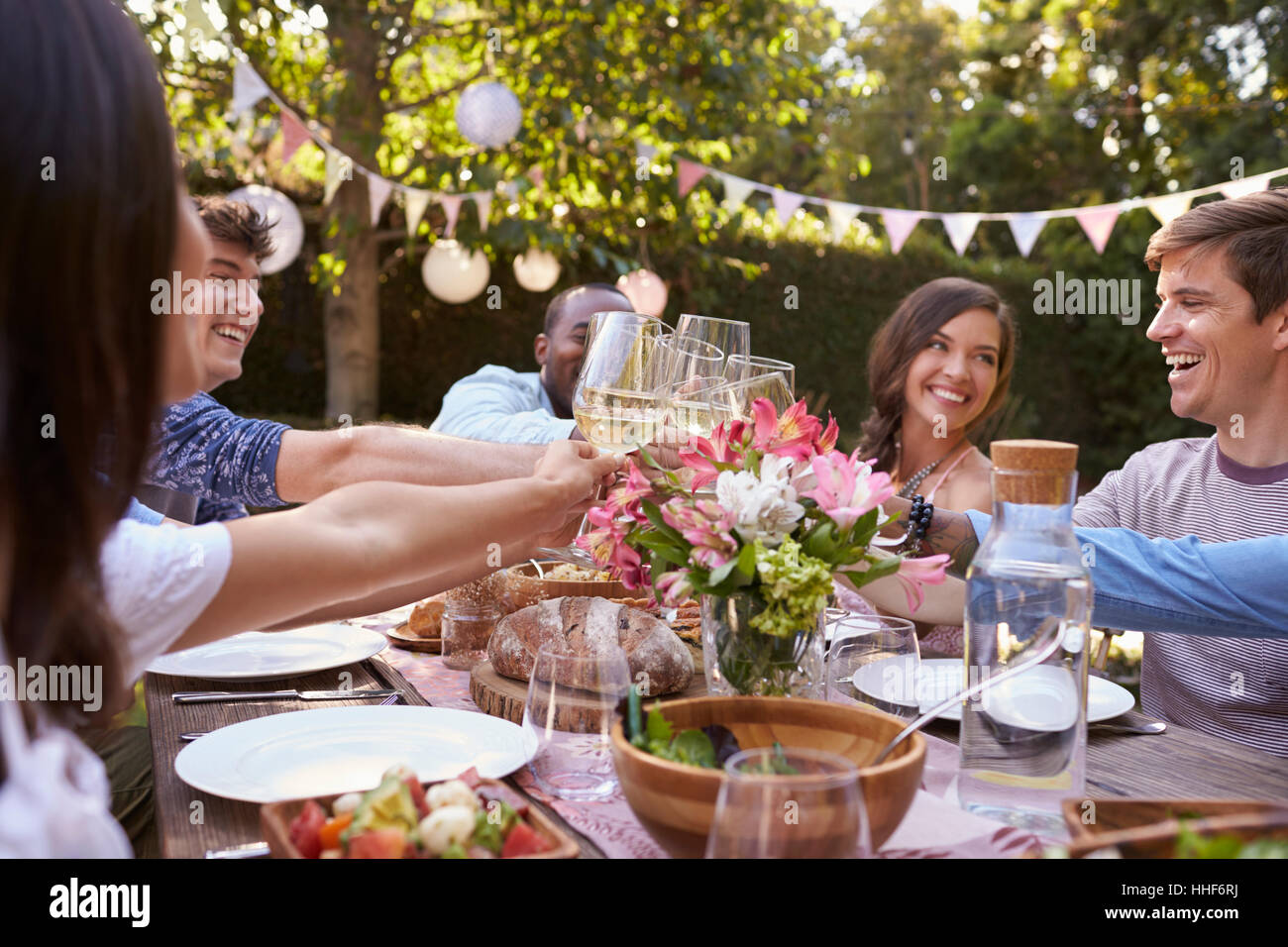 Friends Making A Toast At Outdoor Backyard Party Stock Photo - Alamy