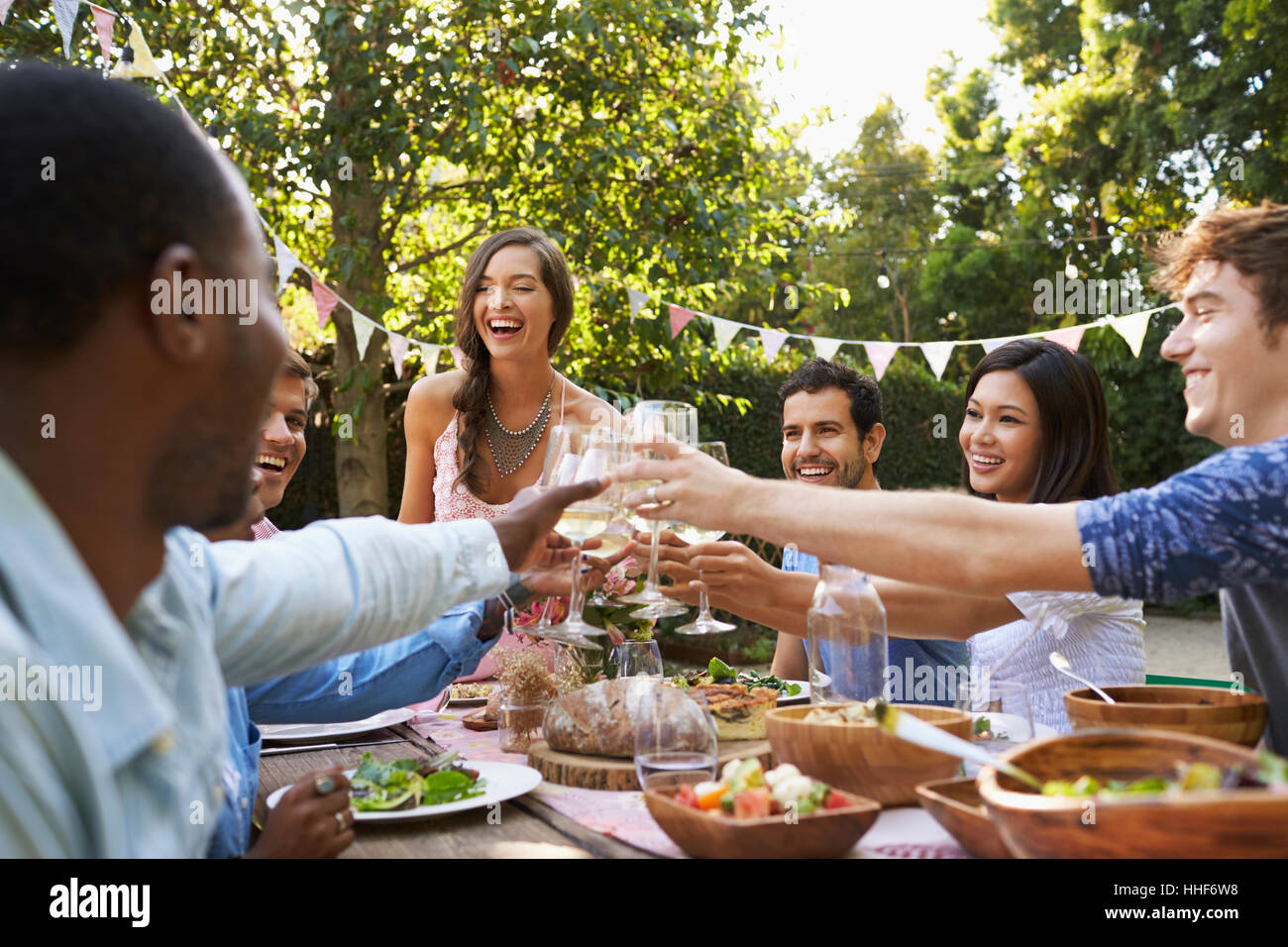 Friends Making A Toast At Outdoor Backyard Party Stock Photo - Alamy