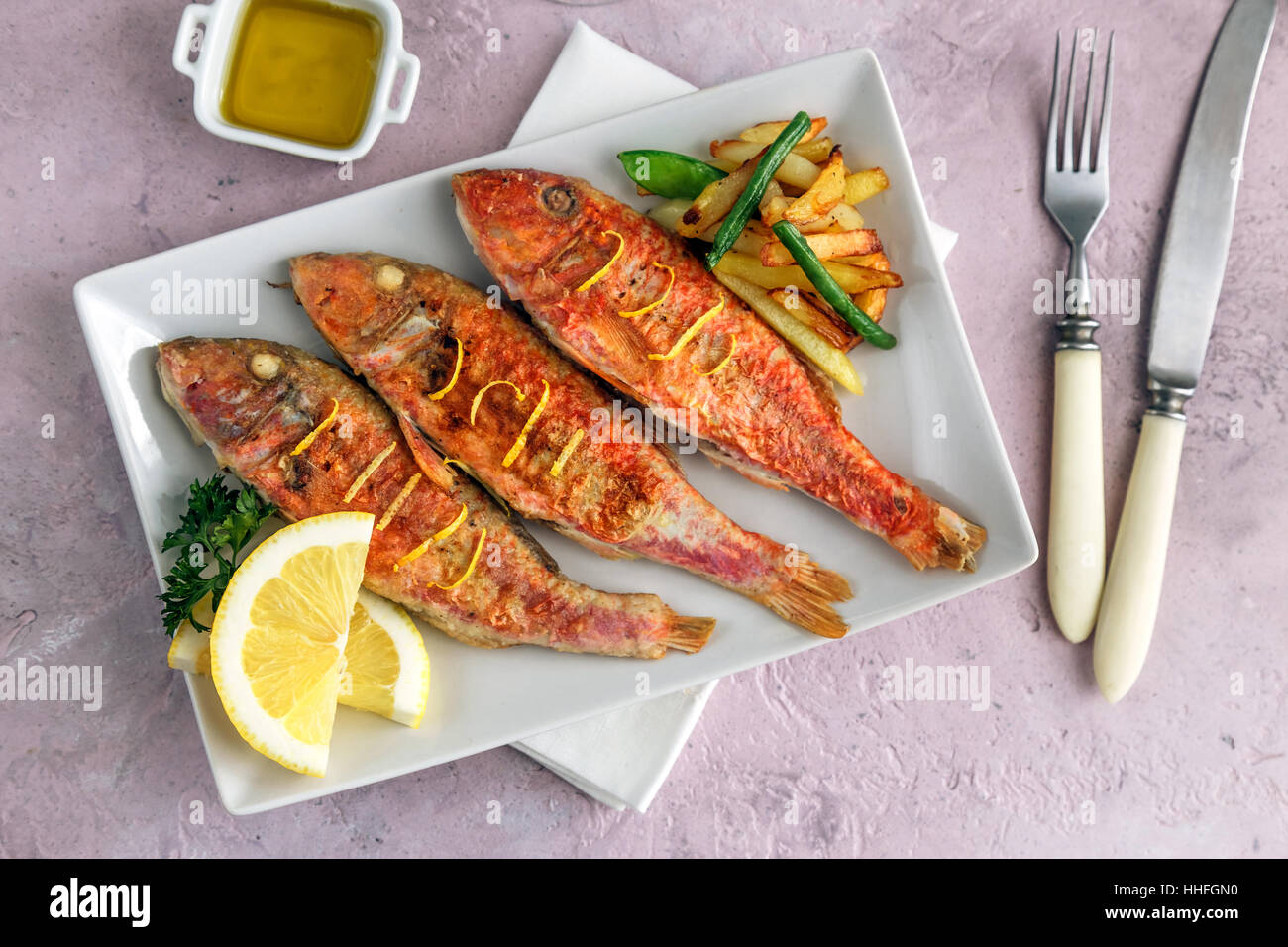 Fried Red Mullet or Turkish Barbunya on Plate, top view Stock Photo - Alamy