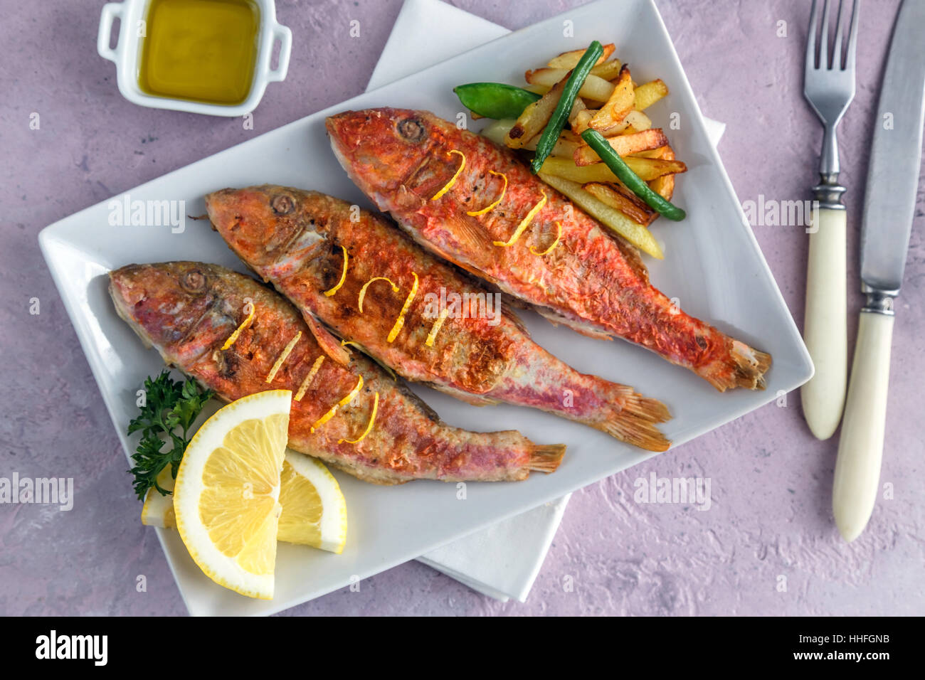 Fried Red Mullet or Turkish Barbunya on Plate, top view Stock Photo - Alamy