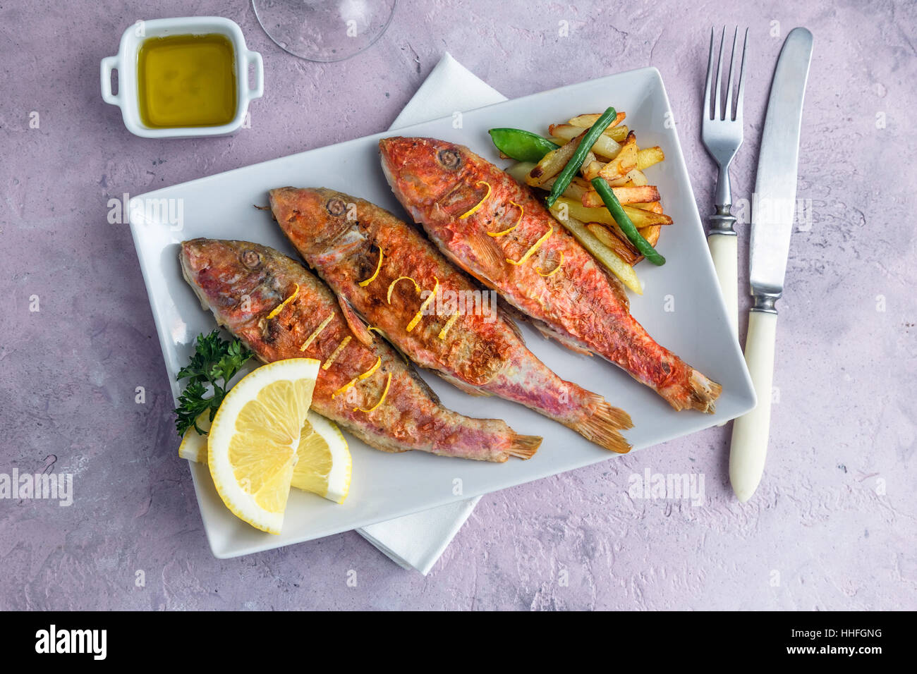 Fried Red Mullet or Turkish Barbunya on Plate, top view Stock Photo - Alamy