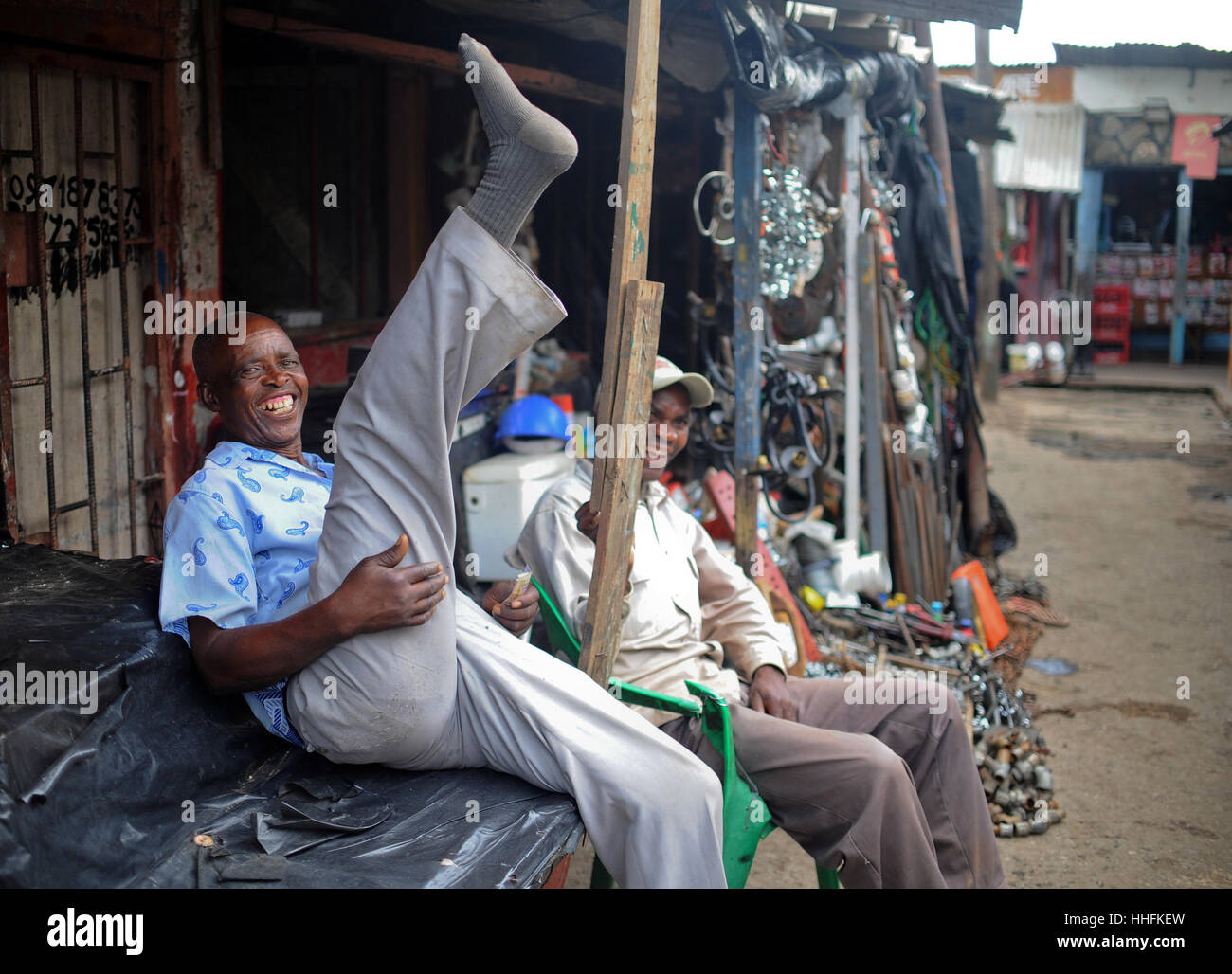 Lusaka, Zambia. 9th Mar, 2016. Men laugh together in the compound ...