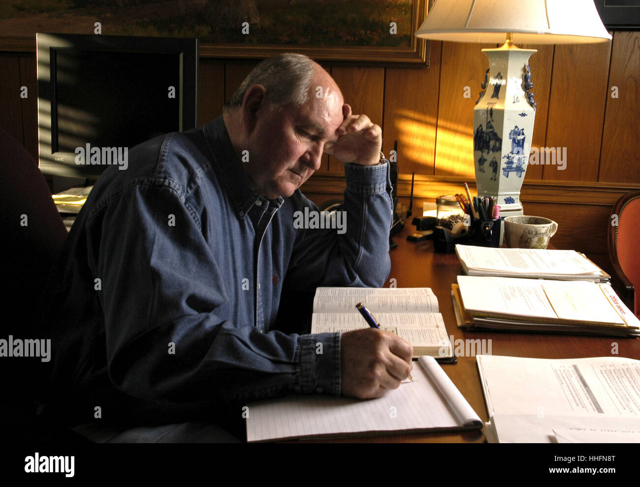 Atlanta, GA, USA. 18th Mar, 2005. Gov. SONNY PERDUE studies scripture ...