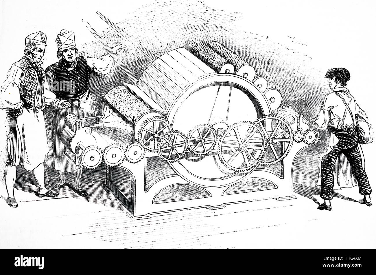 Female is shown observing the Cotton Carding machine. Used to create a ...