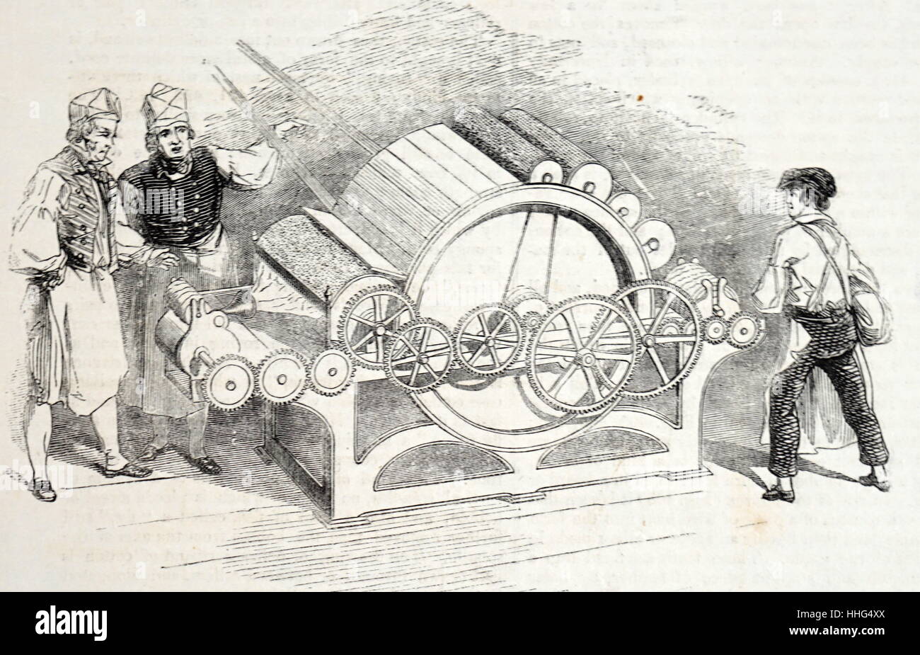 Three males are shown operating the Cotton Carding machine. Used to ...