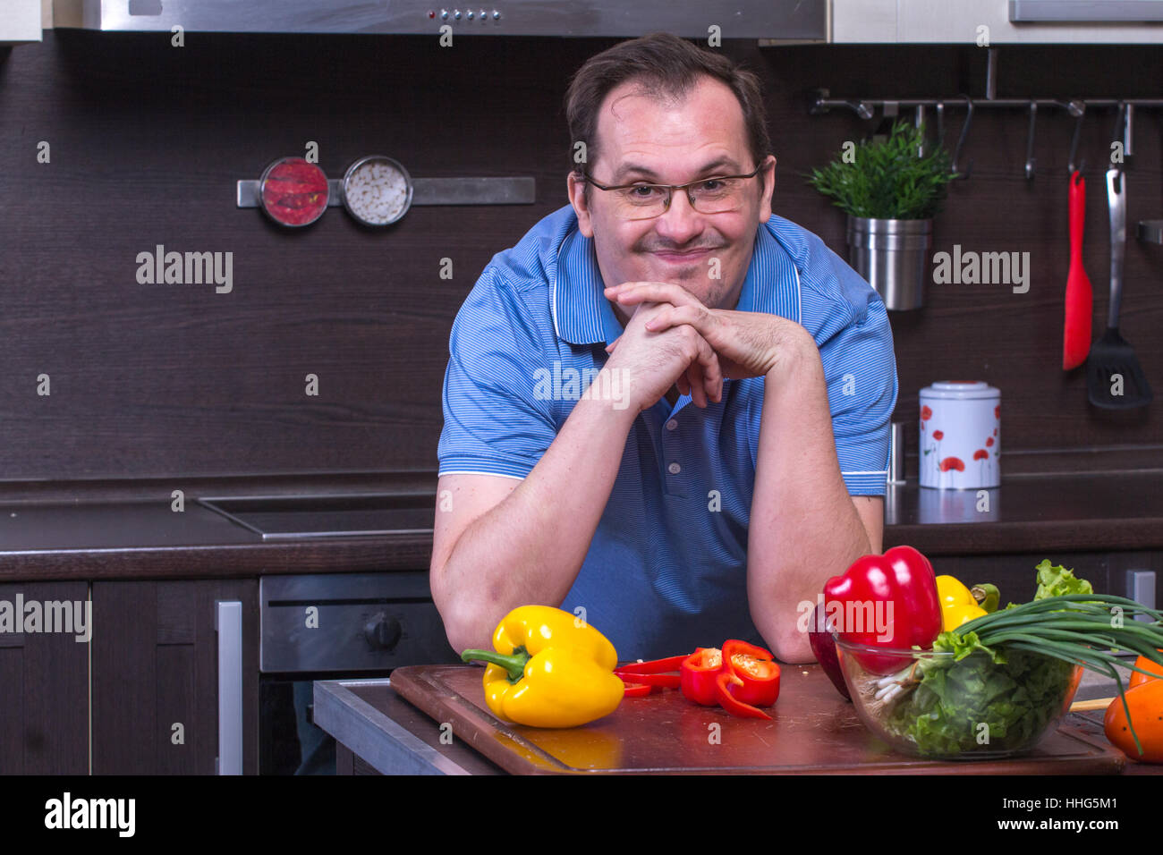 Portrait adult sad man cooking hi-res stock photography and images - Alamy