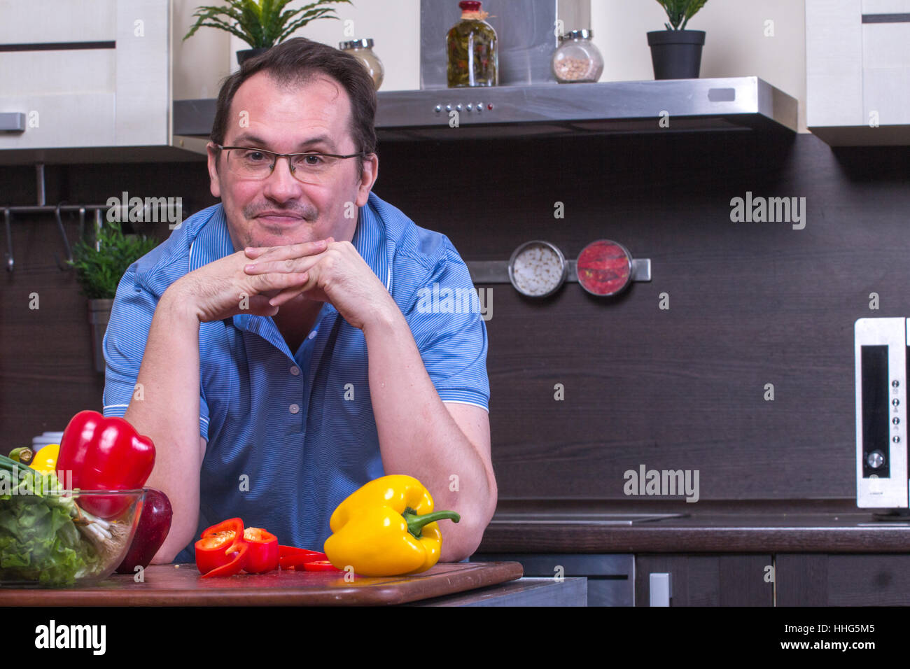 Portrait adult sad man cooking hi-res stock photography and images - Alamy