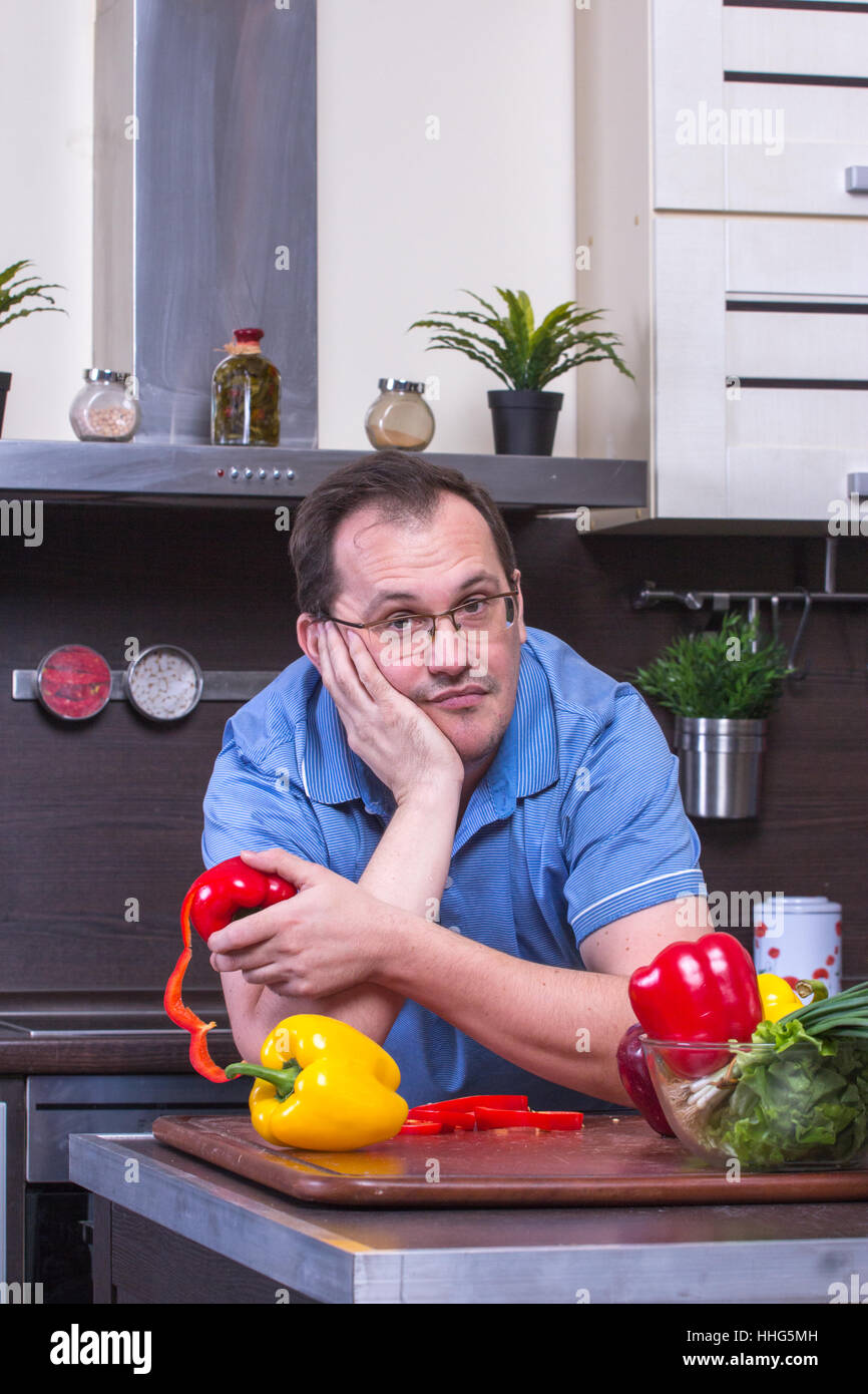 Portrait adult sad man cooking hi-res stock photography and images - Alamy