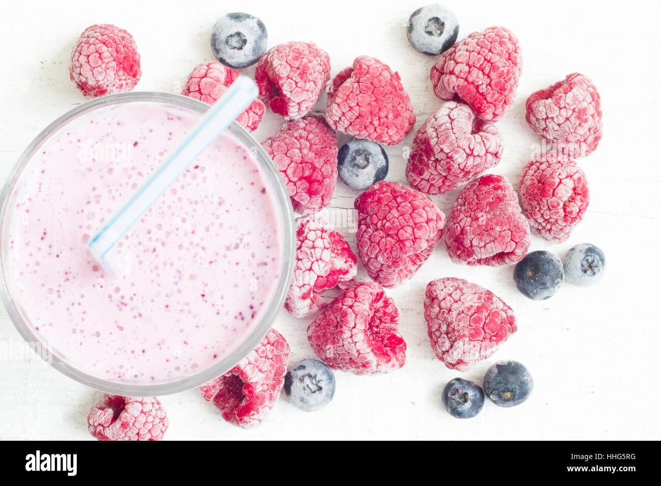 Raspberry shake, smoothie with frozen frost berry on old wooden ...