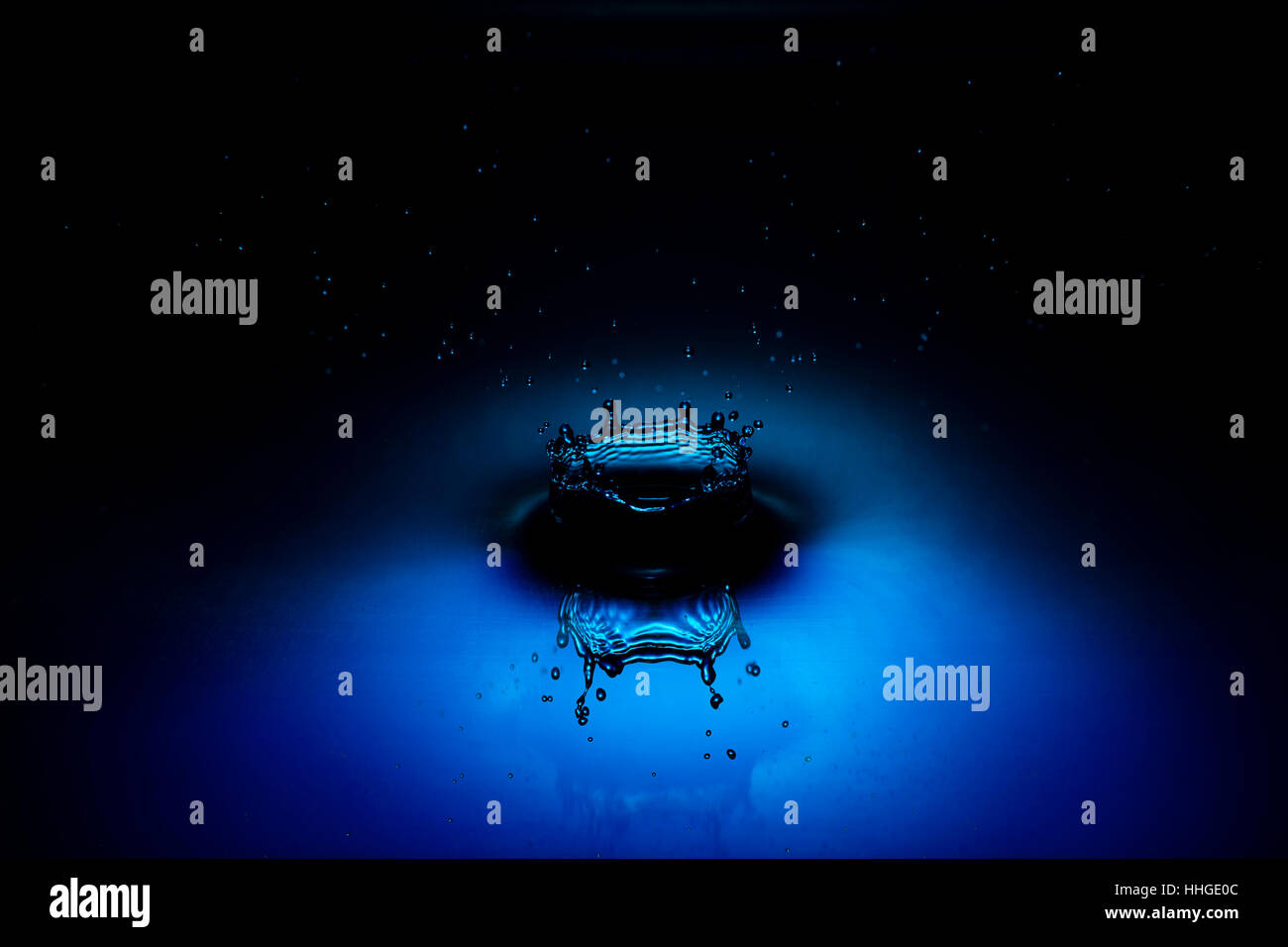 Water Splash In Blue And Black Stock Photo - Alamy