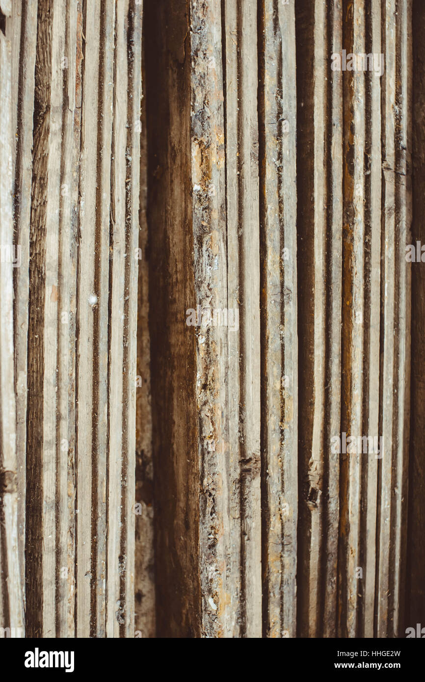 Background of horizontally lying raw rough wooden planks with bark ...
