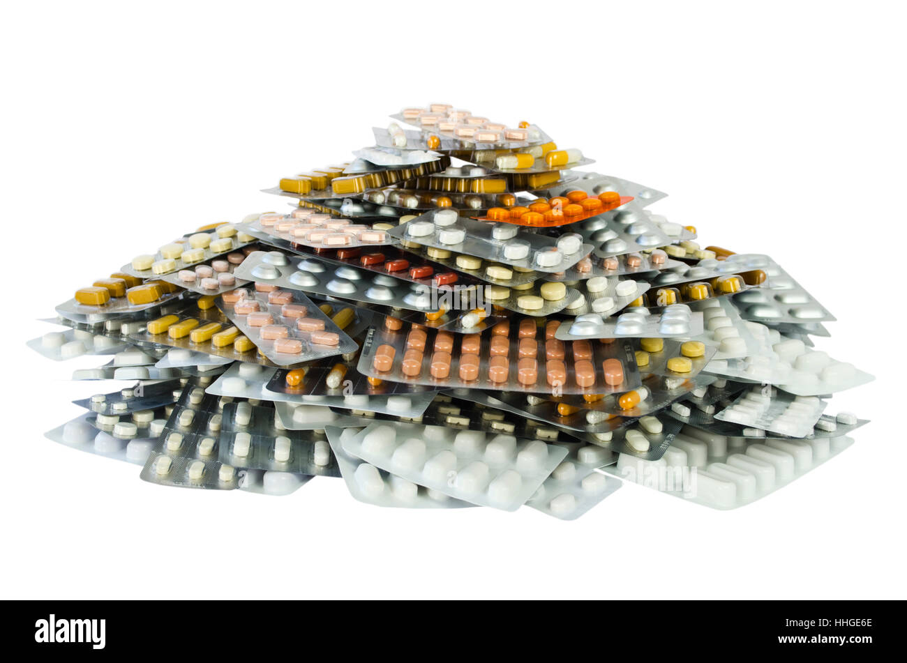 a pile of tablets and pills against white background Stock Photo - Alamy