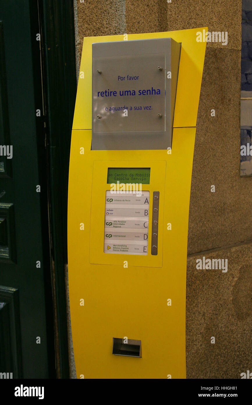 Queue ticket machine at Portuguese railway station Stock Photo - Alamy