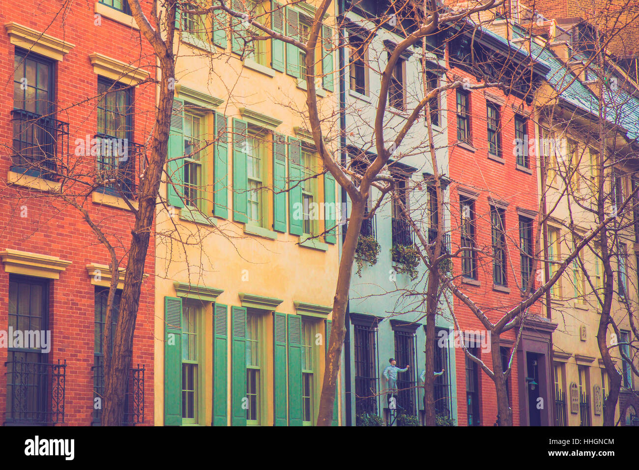 Charming row of colorful apartment building homes on quaint street in ...