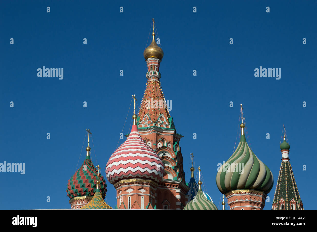 The ornate red brick exterior and colorful onion domes of St. Basil's ...