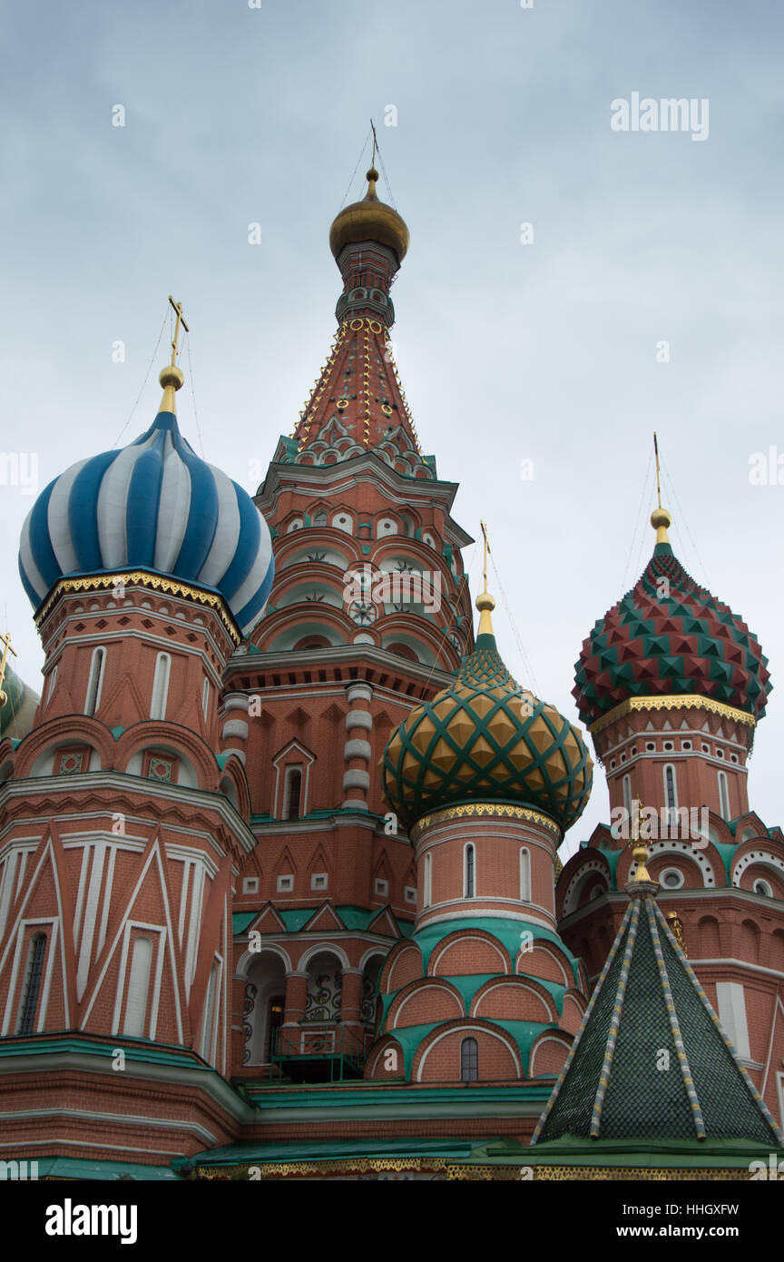 The ornate red brick exterior and colorful onion domes of St. Basil's ...