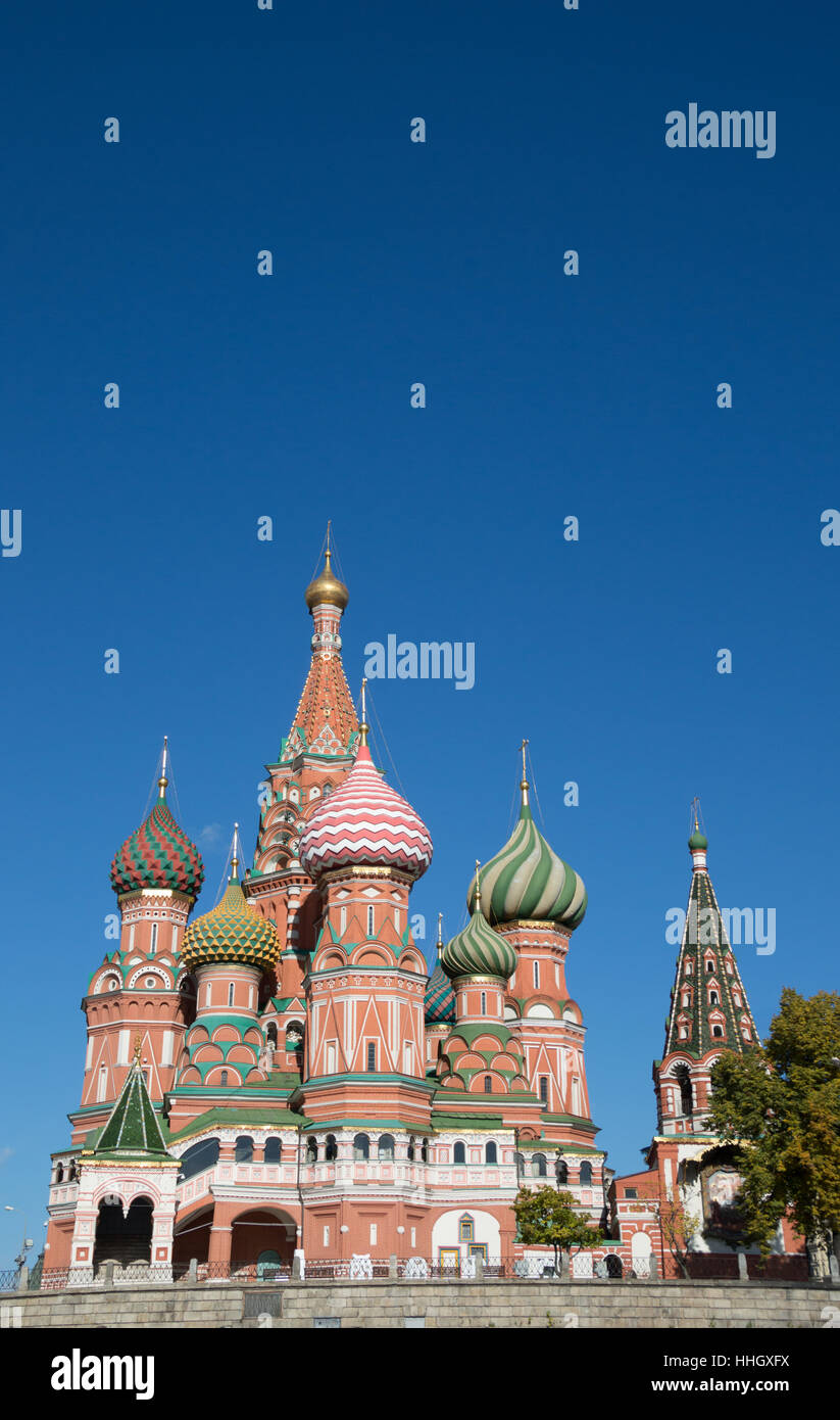 The ornate red brick exterior and colorful onion domes of St. Basil's ...