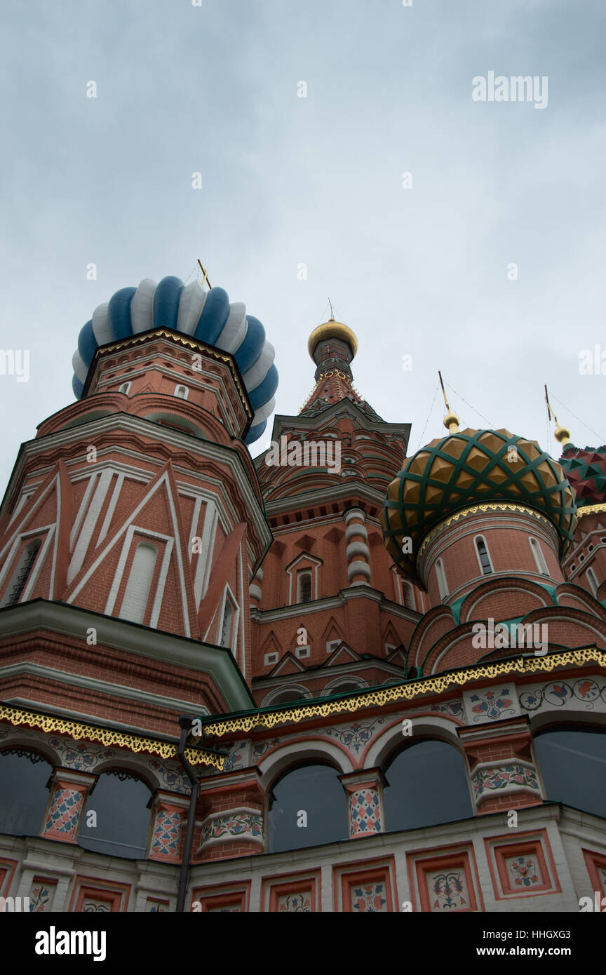 The ornate red brick exterior and colorful onion domes of St. Basil's ...