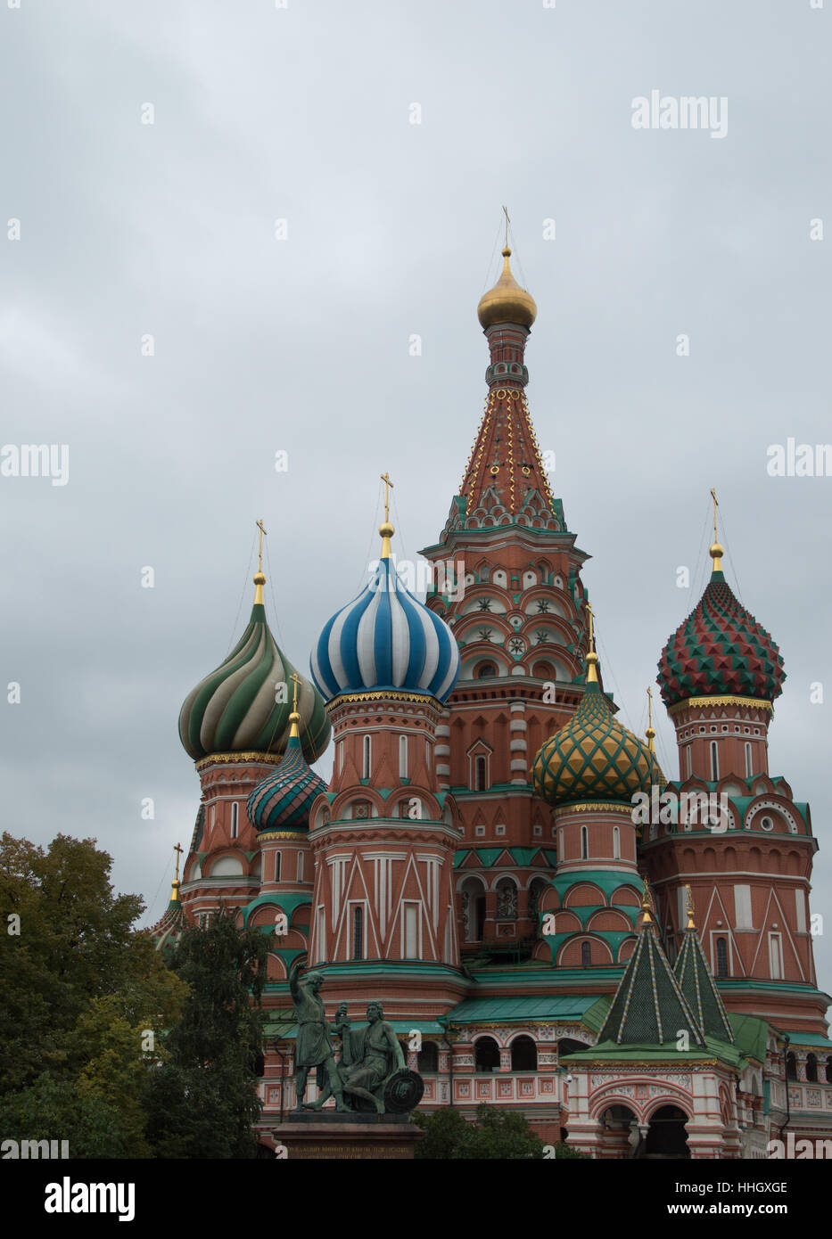 The ornate red brick exterior and colorful onion domes of St. Basil's ...