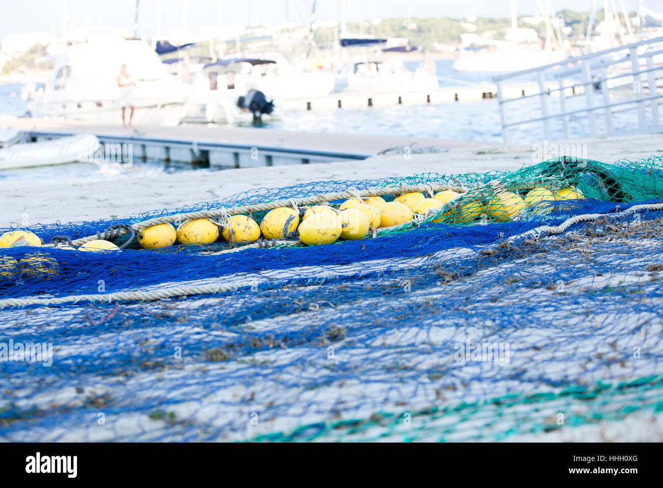 fishing net with linen and ropes on ship at the quay at the port in ...