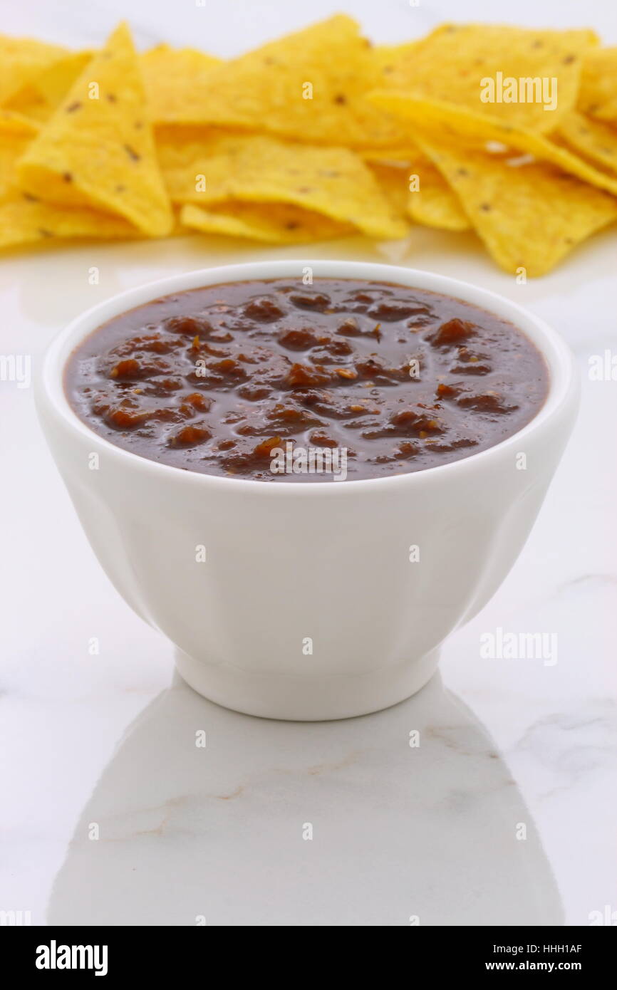 Artisan mexican chipotle sauce on vintage carrara marble table, with a ...