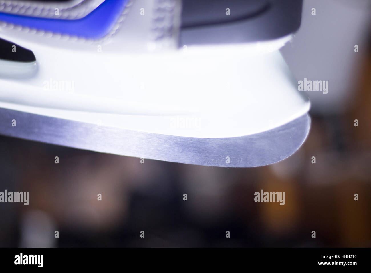 Ice skates in skate store shop window on display on sale for skating on ...