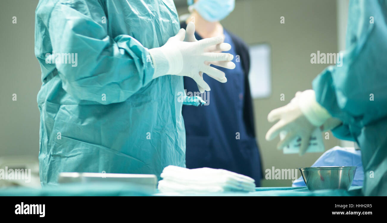 Surgeon in hospital surgery in sterile uniform "scrubs" in operating ...