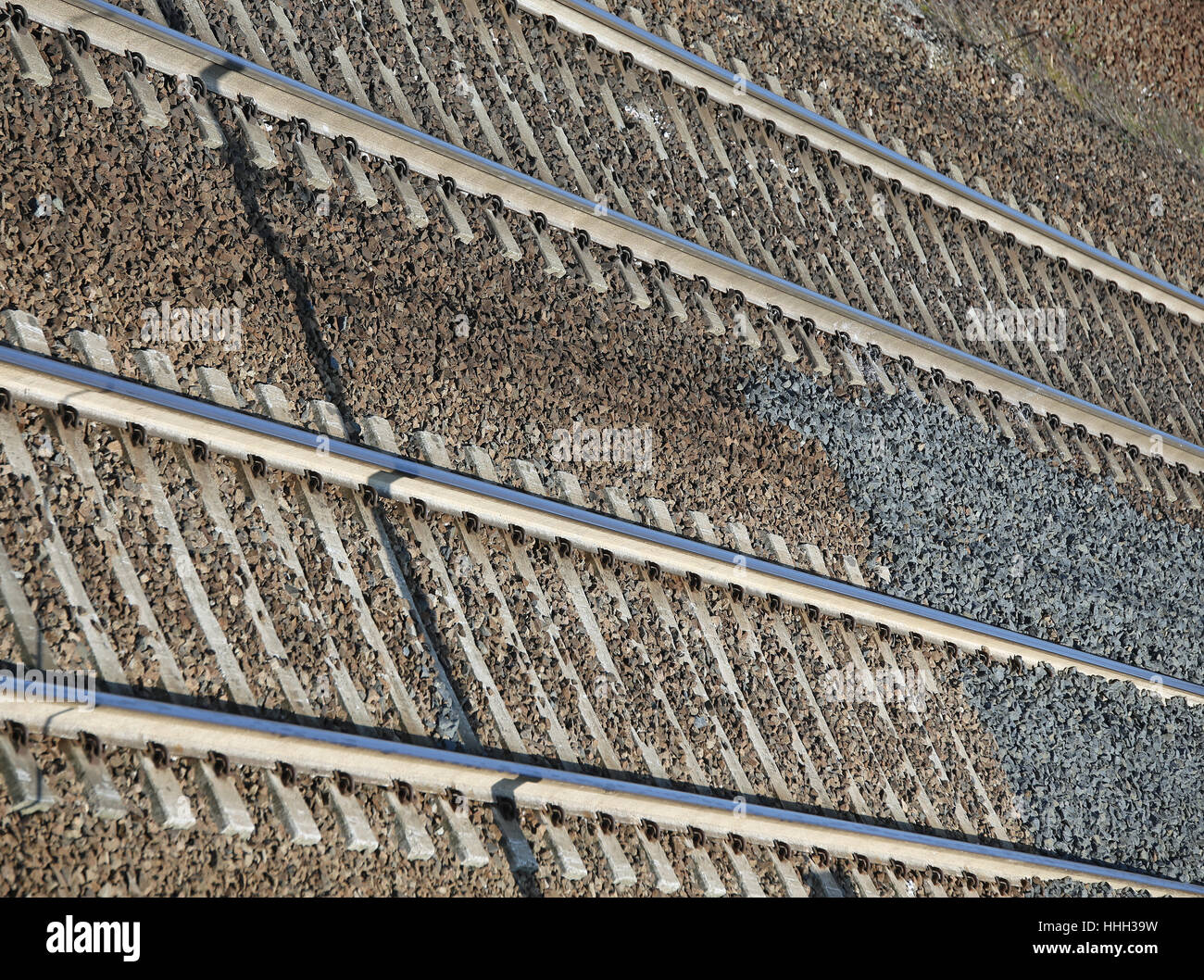 Train tracks background with long iron rails Stock Photo - Alamy