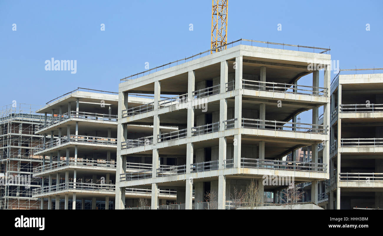 immense building under construction with concrete walls in the city ...
