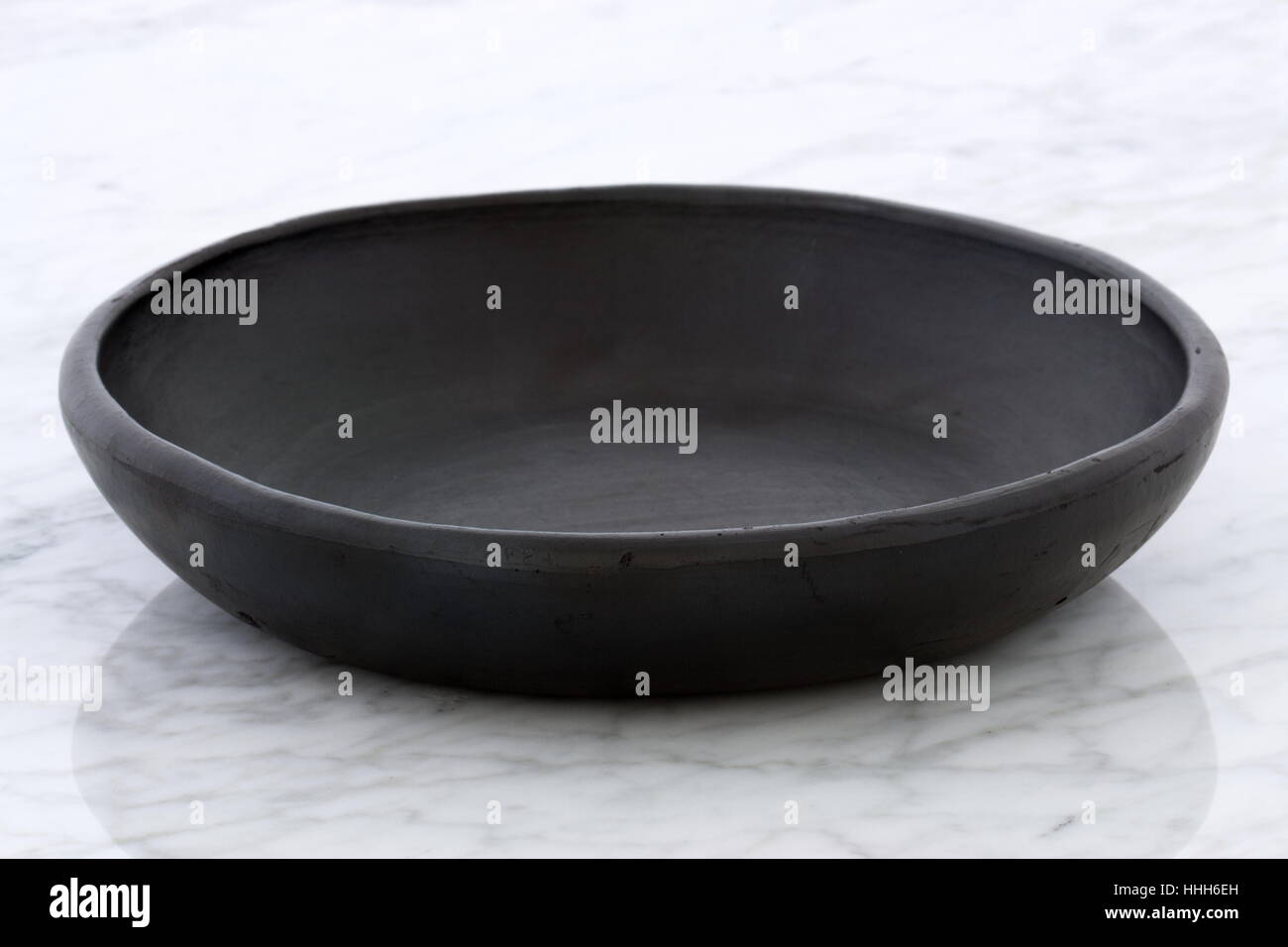colombian clay plate on vintage carrara marble Stock Photo - Alamy