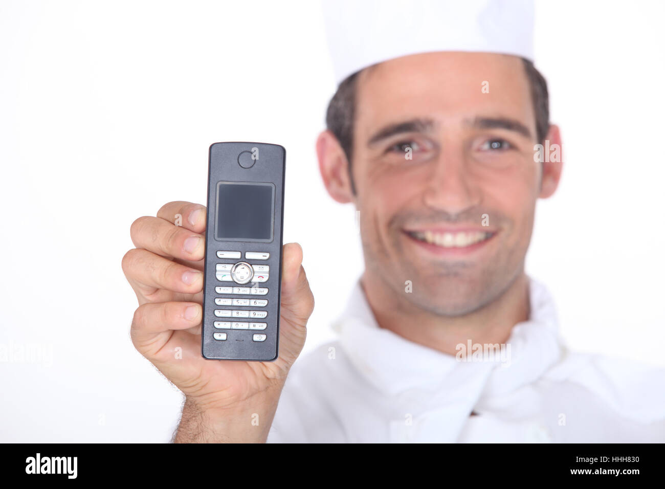 Chef holding up telephone hi-res stock photography and images - Alamy