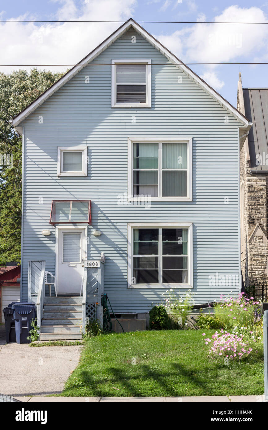 TORONTO, CANADA - Light blue house with white windows in a sunny ...