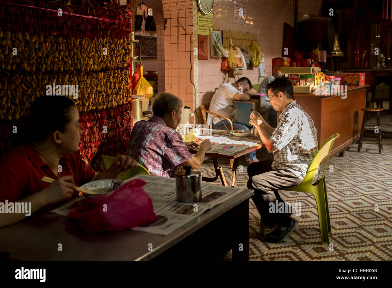 Temple workers have their breakfast inside the Sin Sze Si Ya Temple in ...