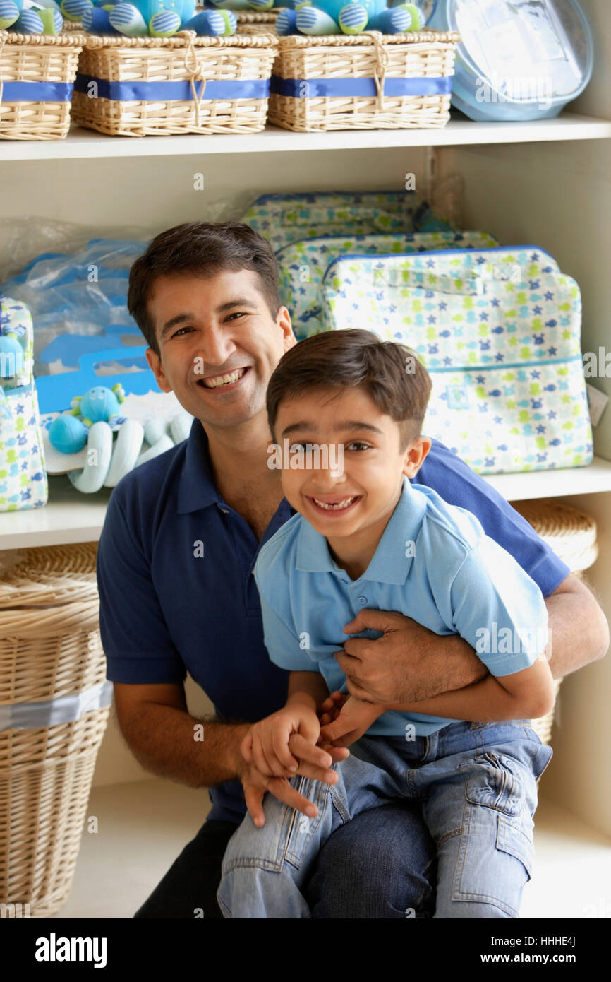 father and son in store Stock Photo - Alamy