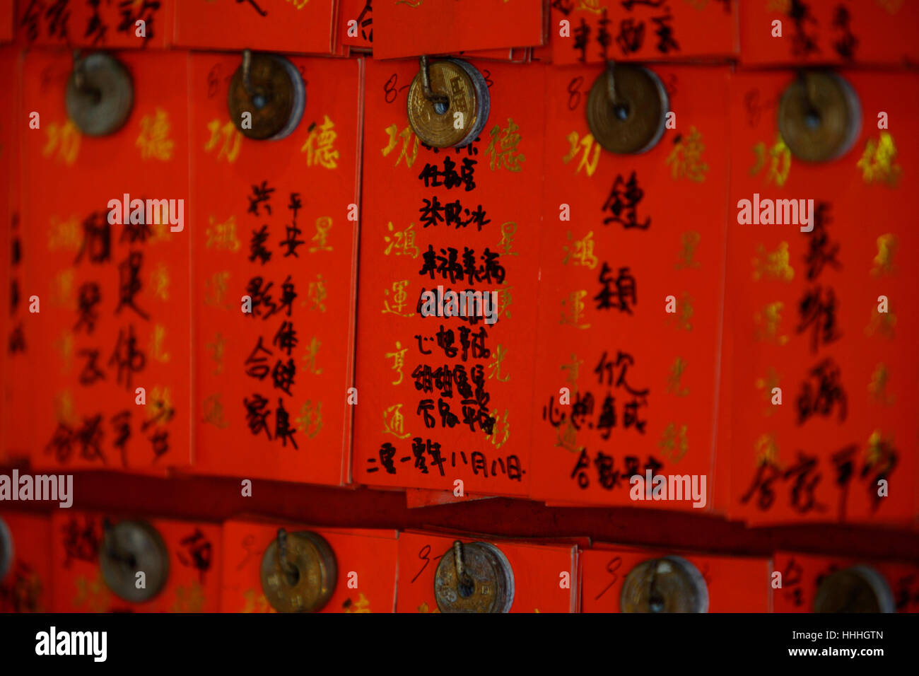 Different fortunes written on red paper at a Buddhist Temple Stock ...