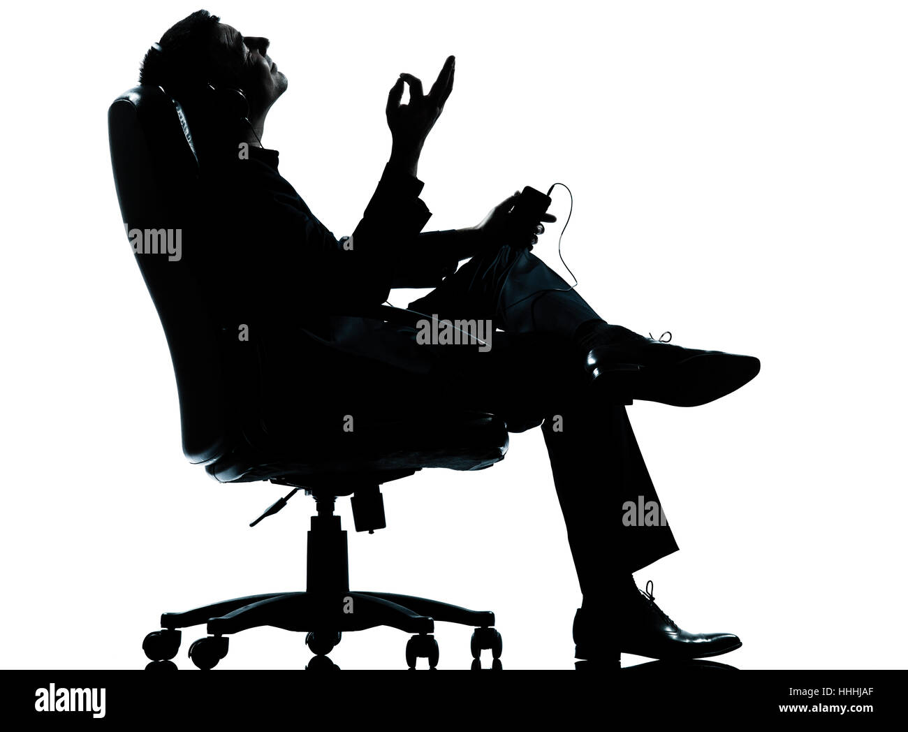 one caucasian business man listening music silhouette Full length in ...