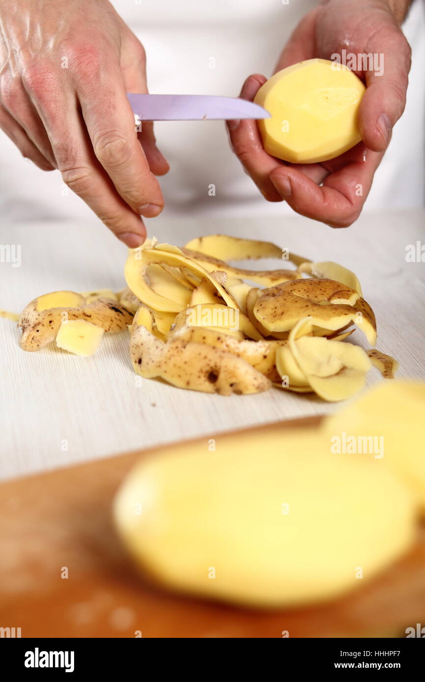 Removing potato eye. Making Potato and Leek Filo Pie. Series Stock ...