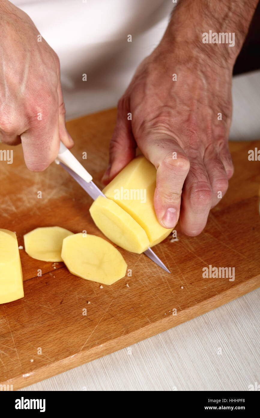 Slicing potato into circles. Making Potato and Leek Filo Pie. Series ...