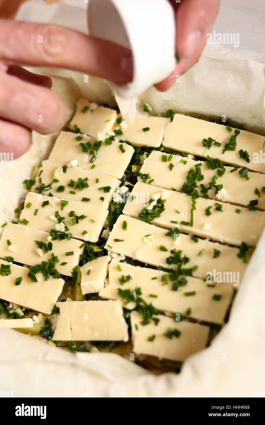 Sprinkle cheese layer with minced garlic. Making Potato and Leek Filo ...