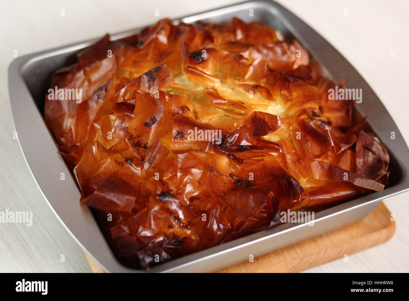 Freshly baked pie in pan. Making Potato and Leek Filo Pie. Series Stock ...