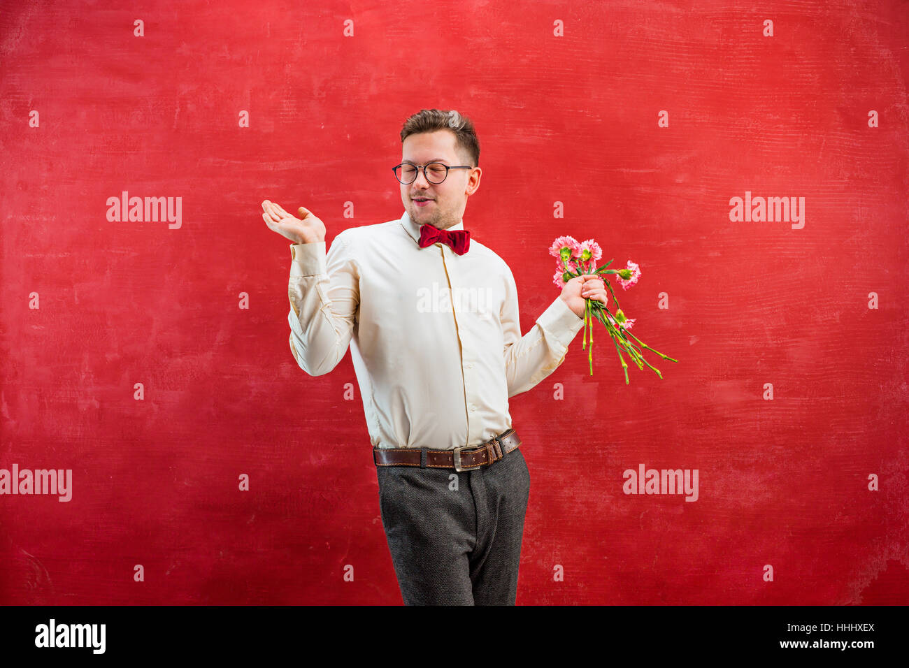 Young beautiful man with flowers Stock Photo - Alamy