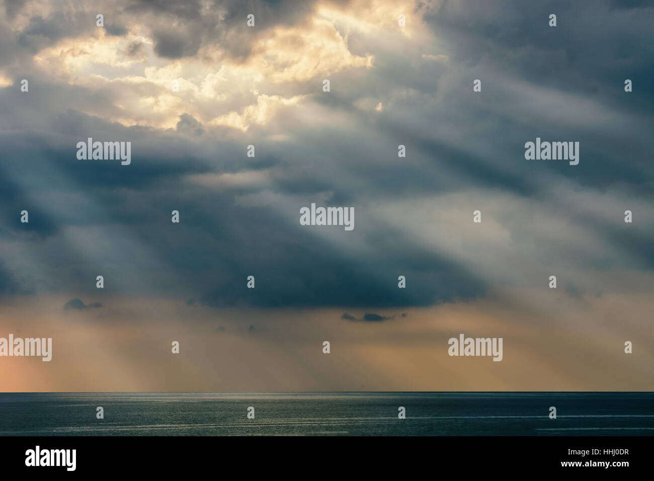 Sun's rays passing through the clouds Stock Photo - Alamy