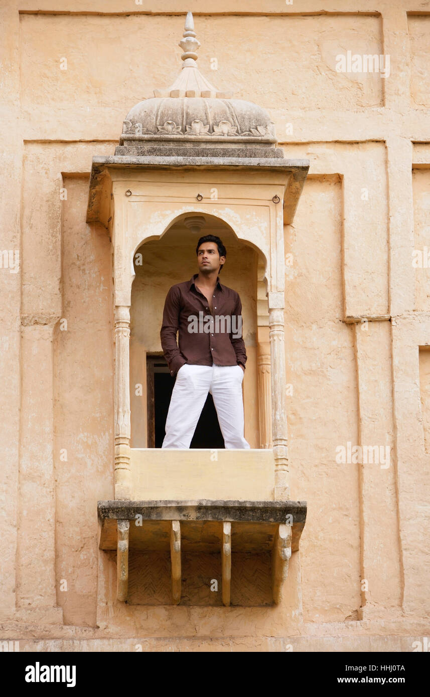 young man on balcony Stock Photo - Alamy