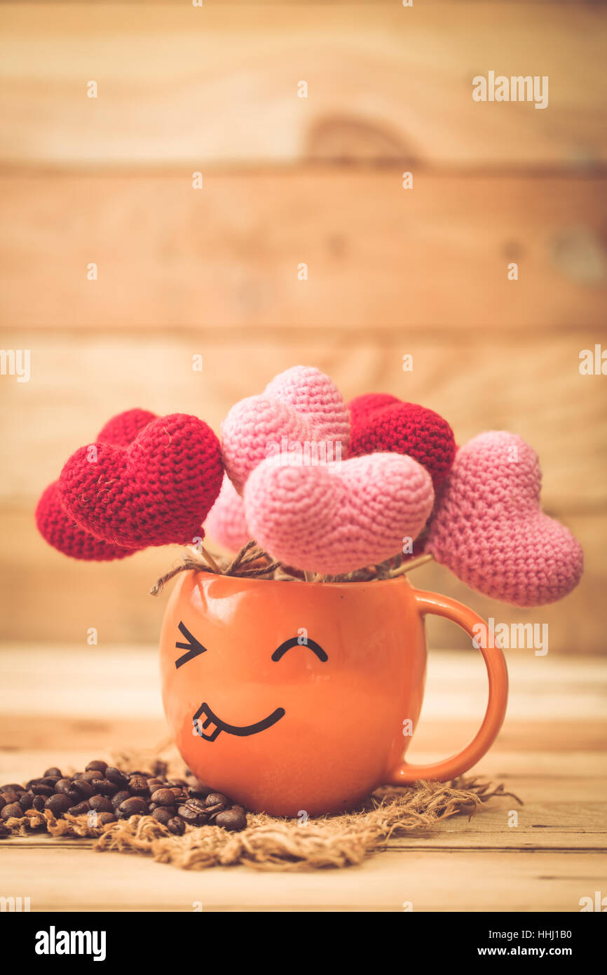 smiley funny coffee cup with heart on wood background, fun happy enjoy ...