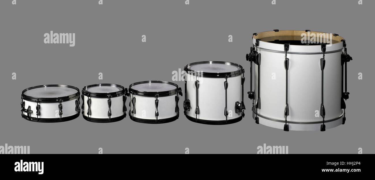 set of white drums in grey back Stock Photo - Alamy