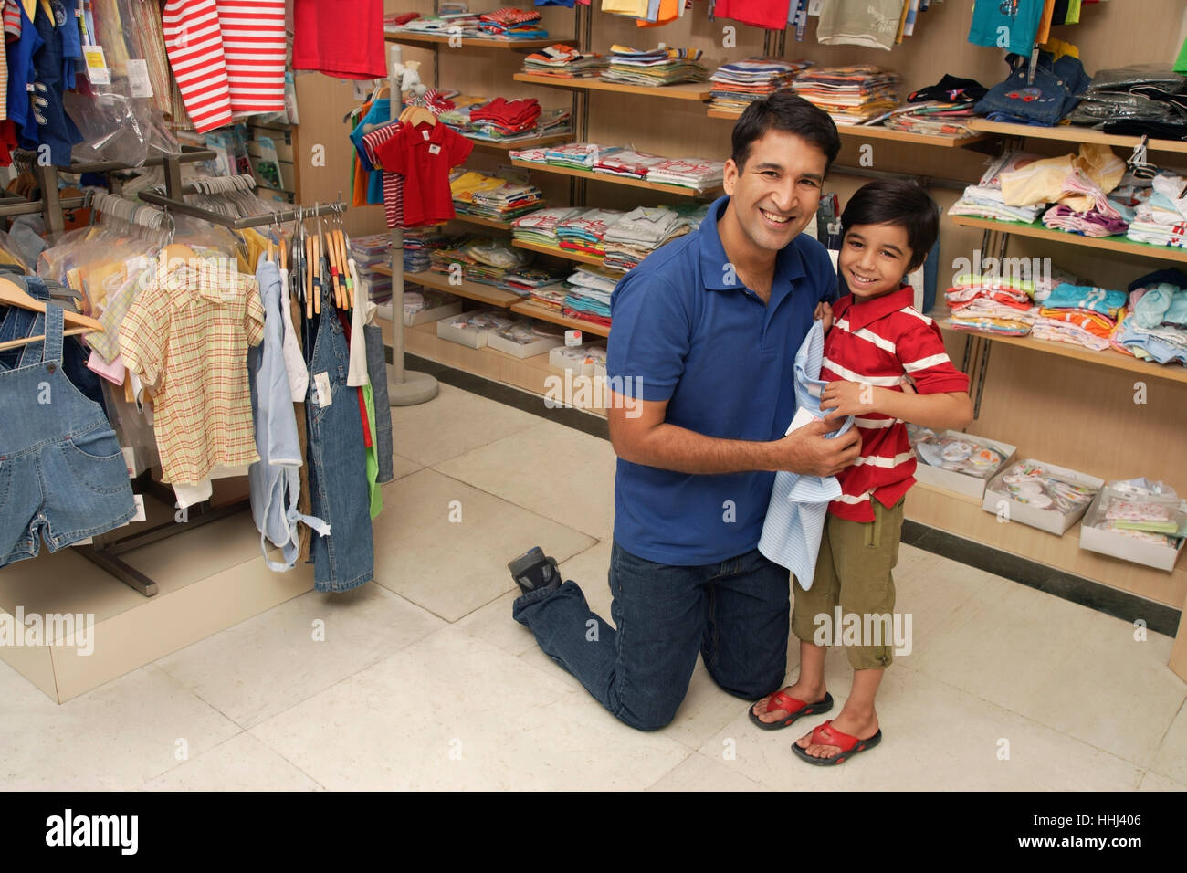 father and son shopping for clothes Stock Photo - Alamy
