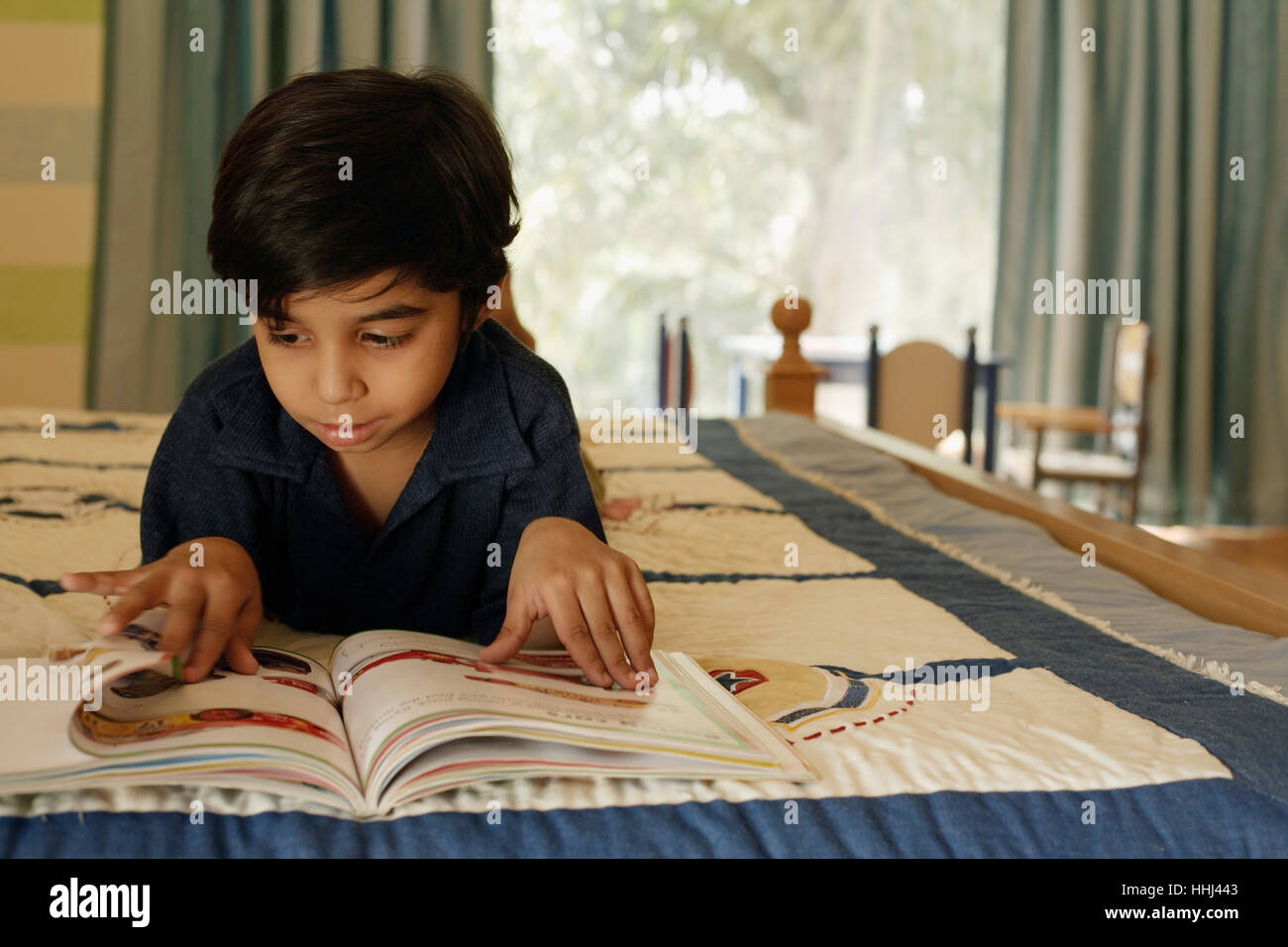 little boy reading book Stock Photo - Alamy