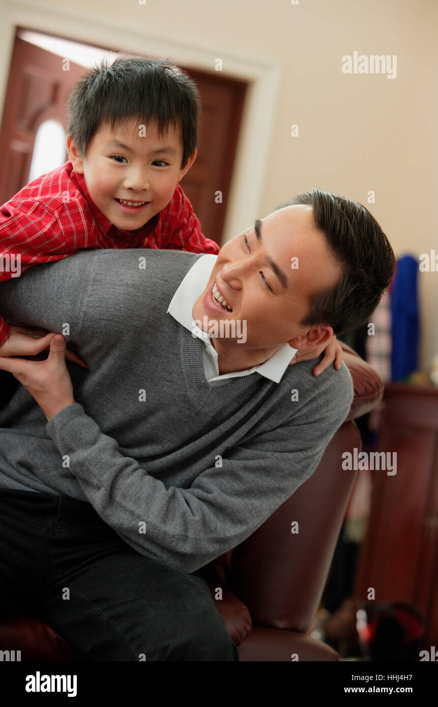 Father and son smiling at camera Stock Photo - Alamy
