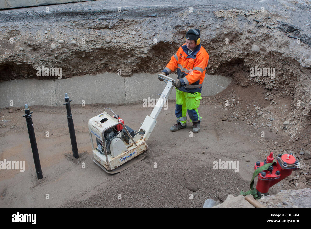 A man working on a construction site Stock Photo - Alamy