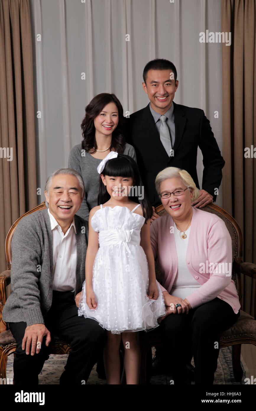 three generation family smiling together Stock Photo - Alamy